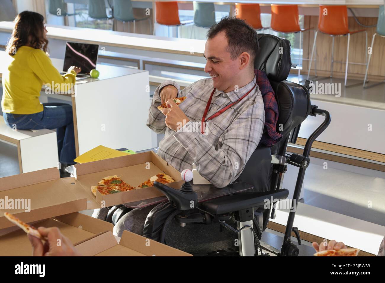 Disabled man enjoying pizza Stock Photo - Alamy