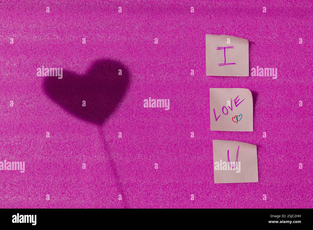 Romantic 'I Love You' message on a sticky note with a pink background ...