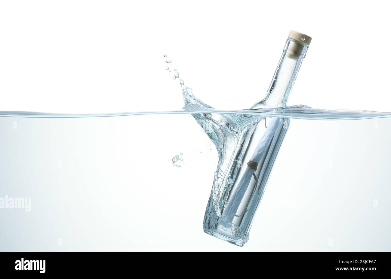 Corked glass bottle with rolled letter in water on white background ...