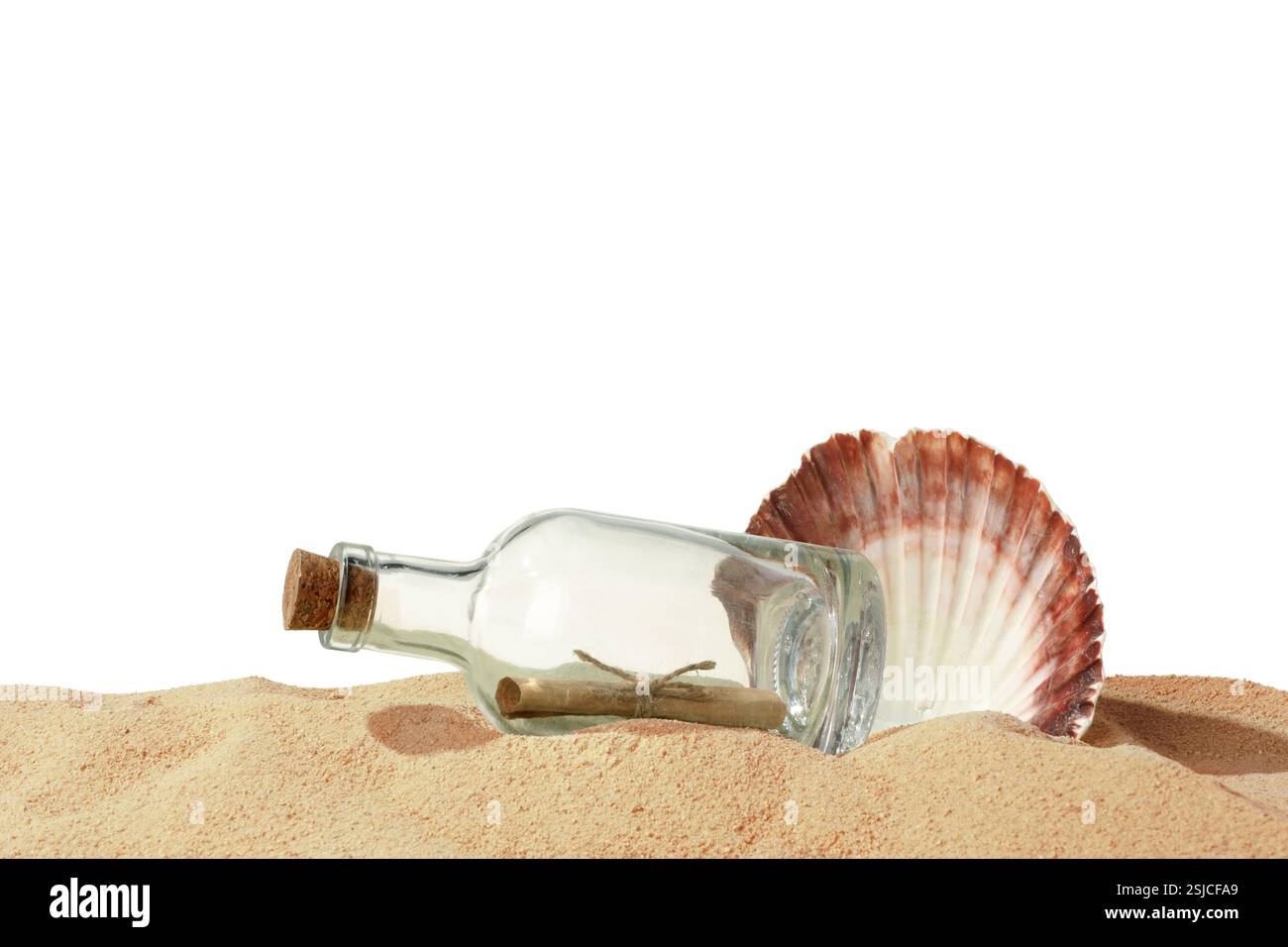 Rolled letter in corked glass bottle and shell on sand against white ...
