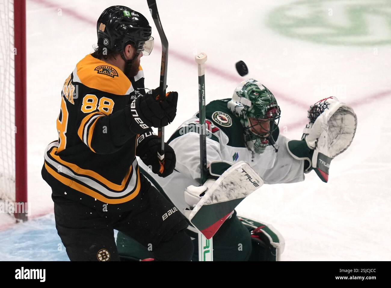 Minnesota Wild goaltender Marc-Andre Fleury (29) deflects the puck off his mask during an NHL ...