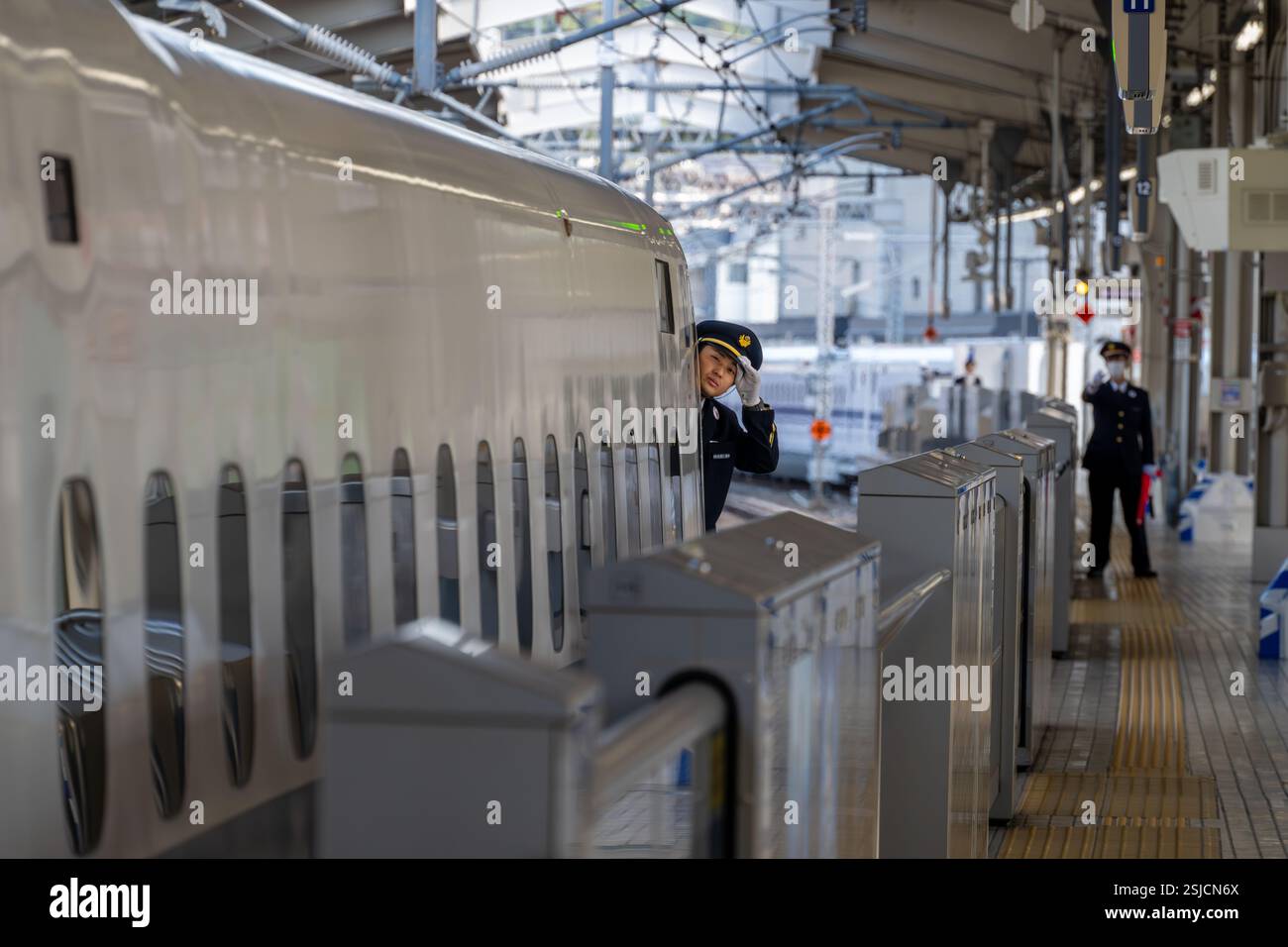 Shinkansen or Bullet Train Guard as Train Depearts Station, Japan Stock ...