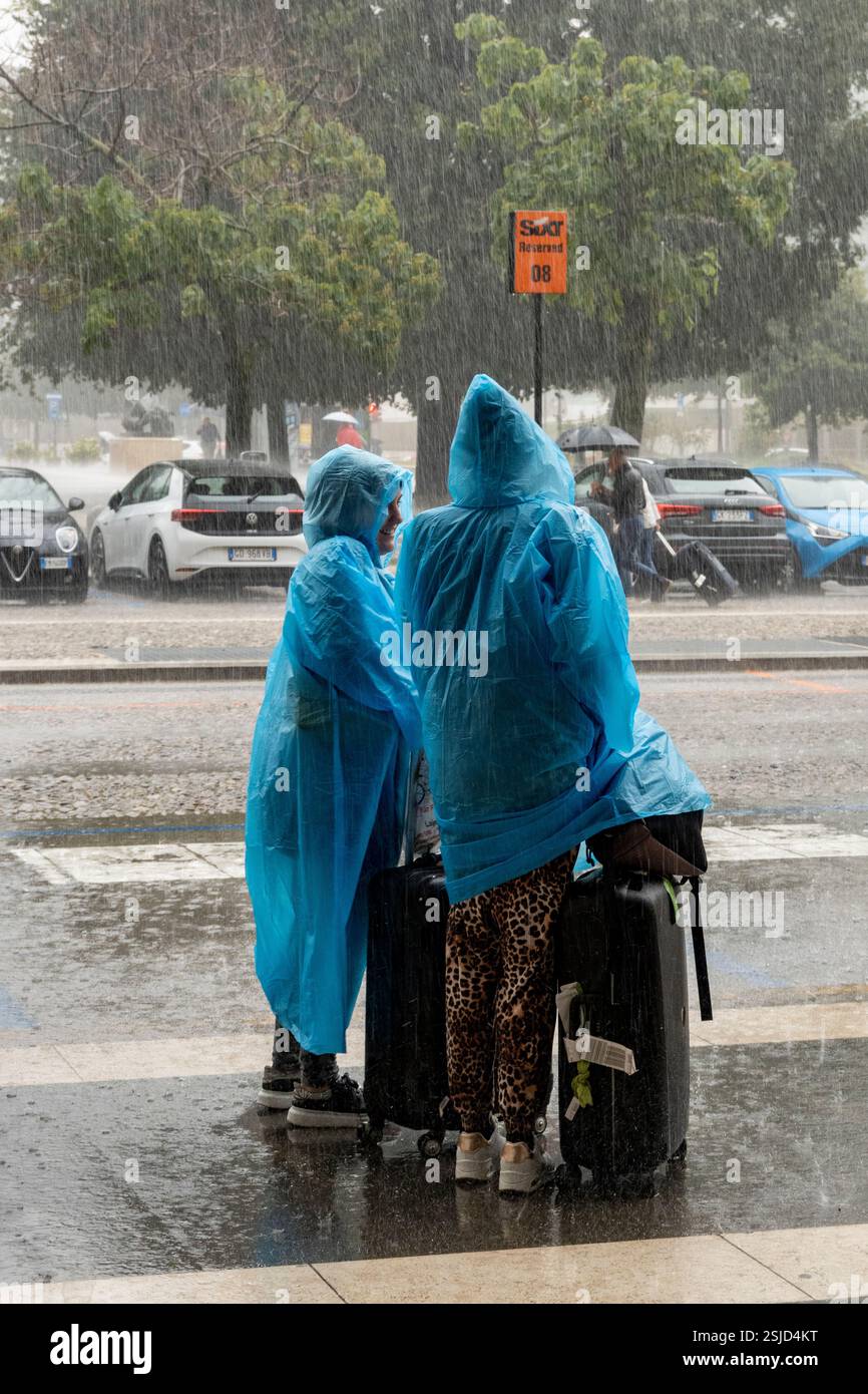 Wet raincoats hi-res stock photography and images - Alamy