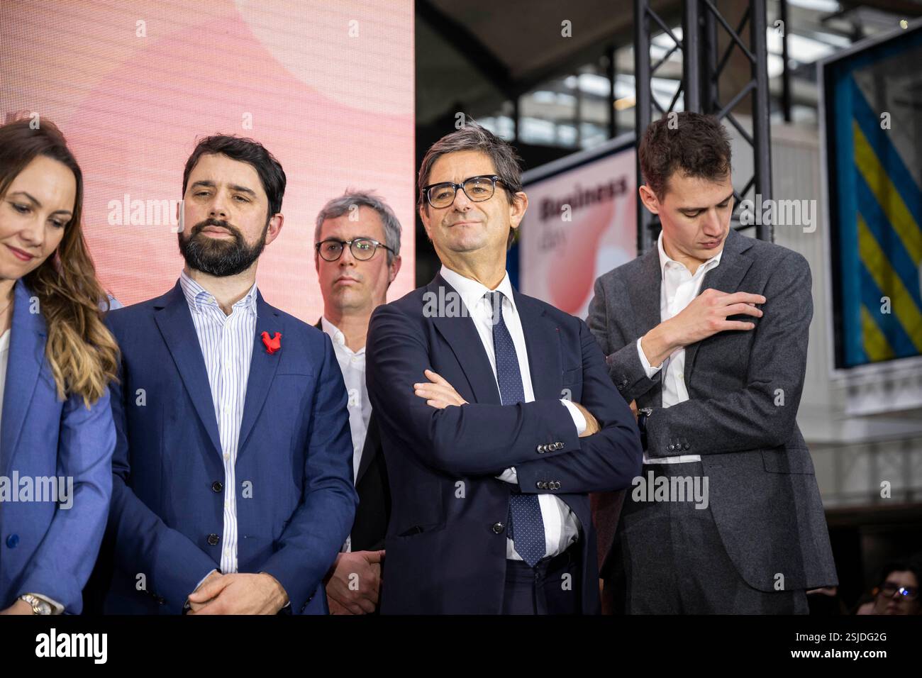 Arthur Mensch, CEO of Mistral AI, right, speaks with Nicolas Dufourcq ...