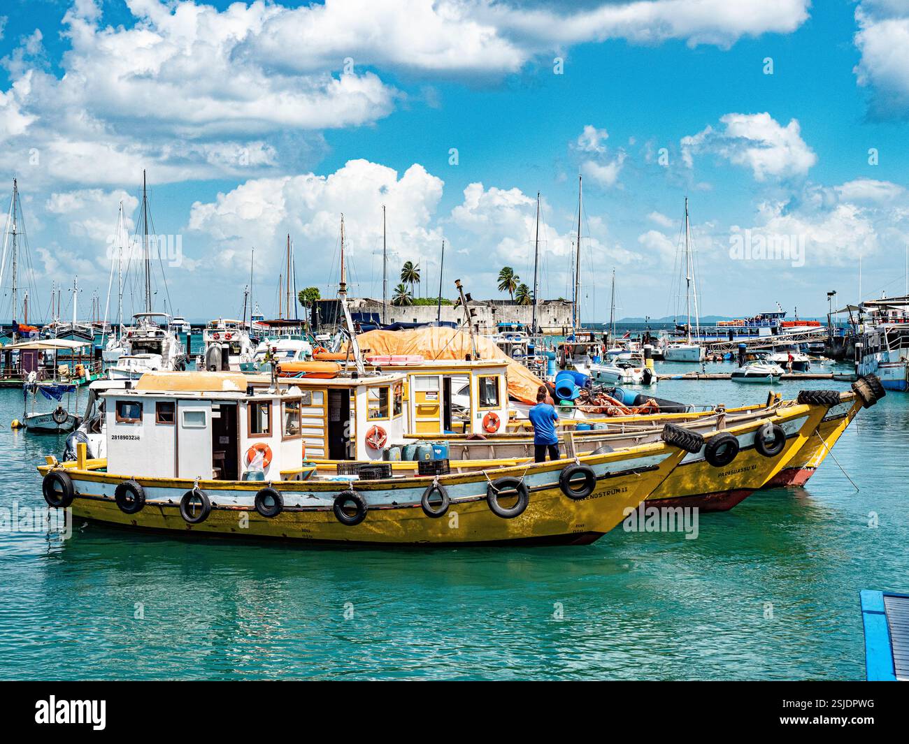 Salvador de Bahia, Brazil. Colourful fishing boats moored side by side ...