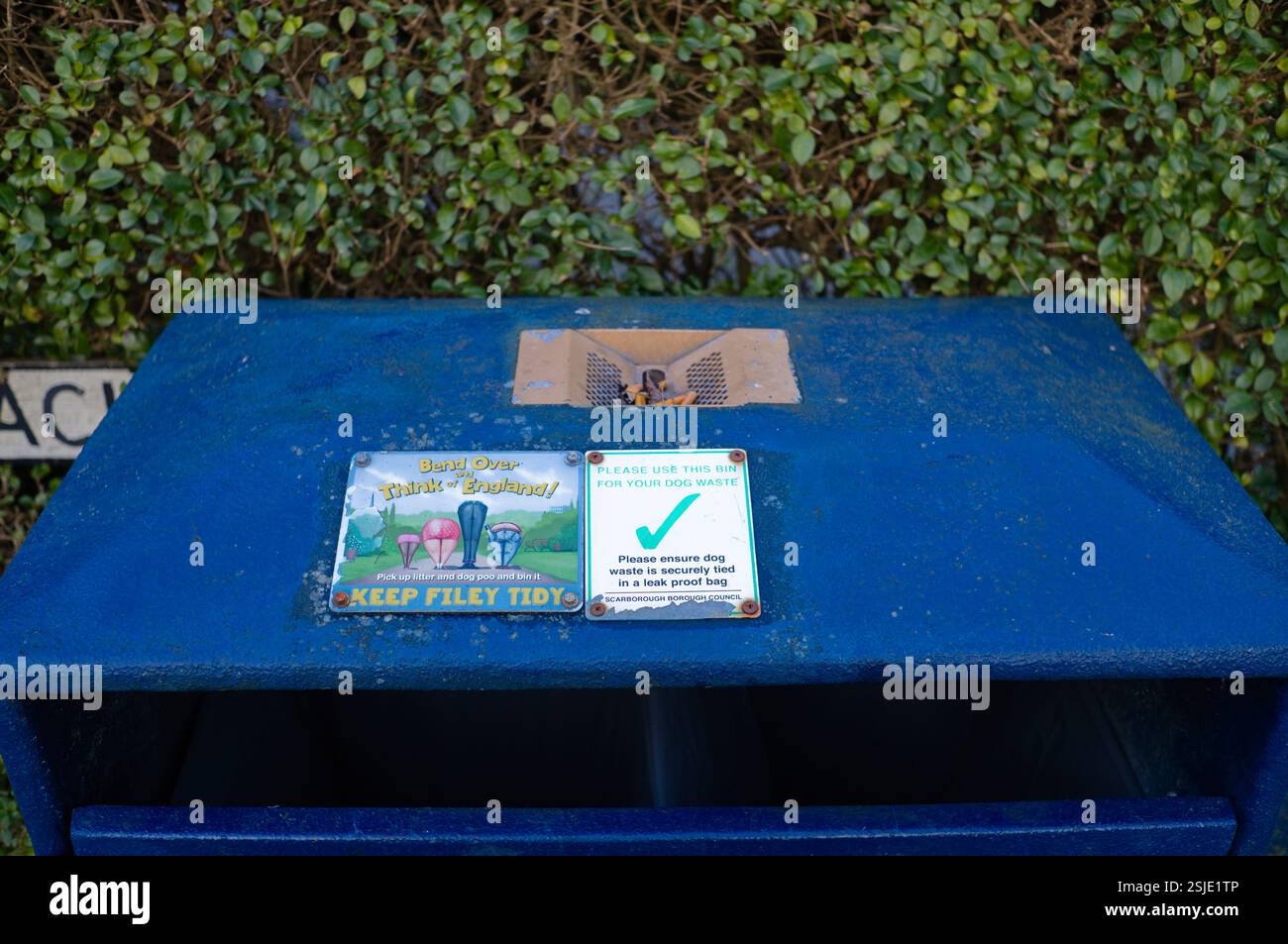 Keep Filey tidy sign on top of a litter bin Stock Photo - Alamy