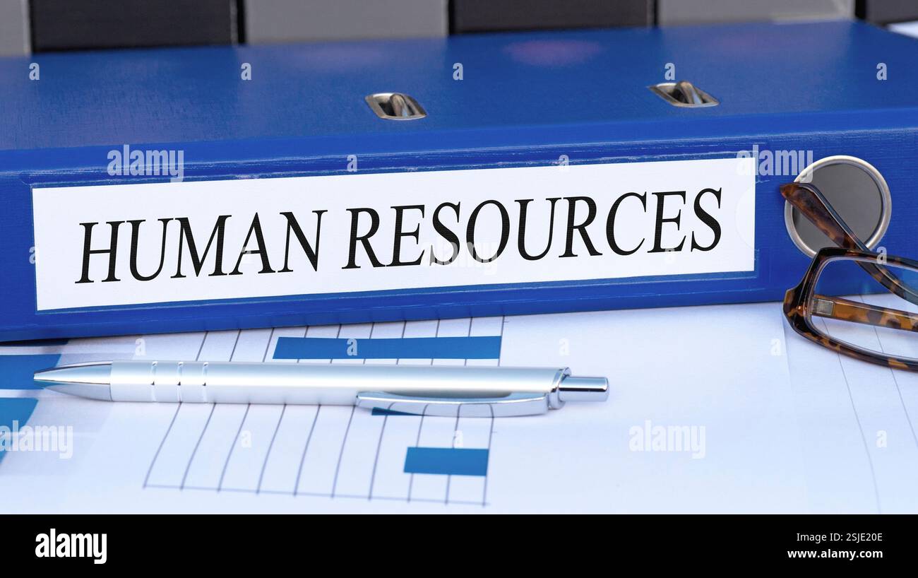 Human Resources folder in the office with pen and glasses Stock Photo ...