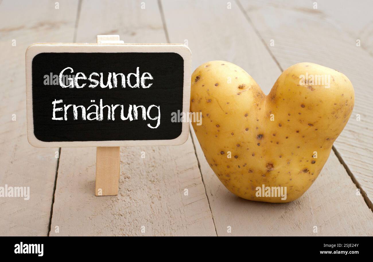 Healthy nutrition potato with shield hi-res stock photography and ...