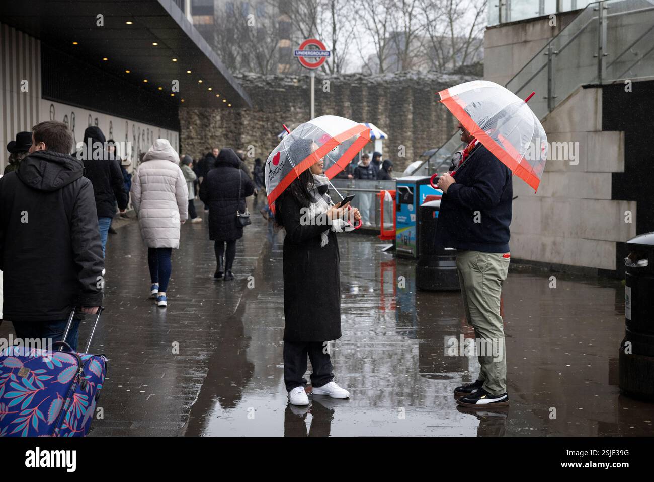 London tourists go about their day whilst sightseeing in Tower Hill ...