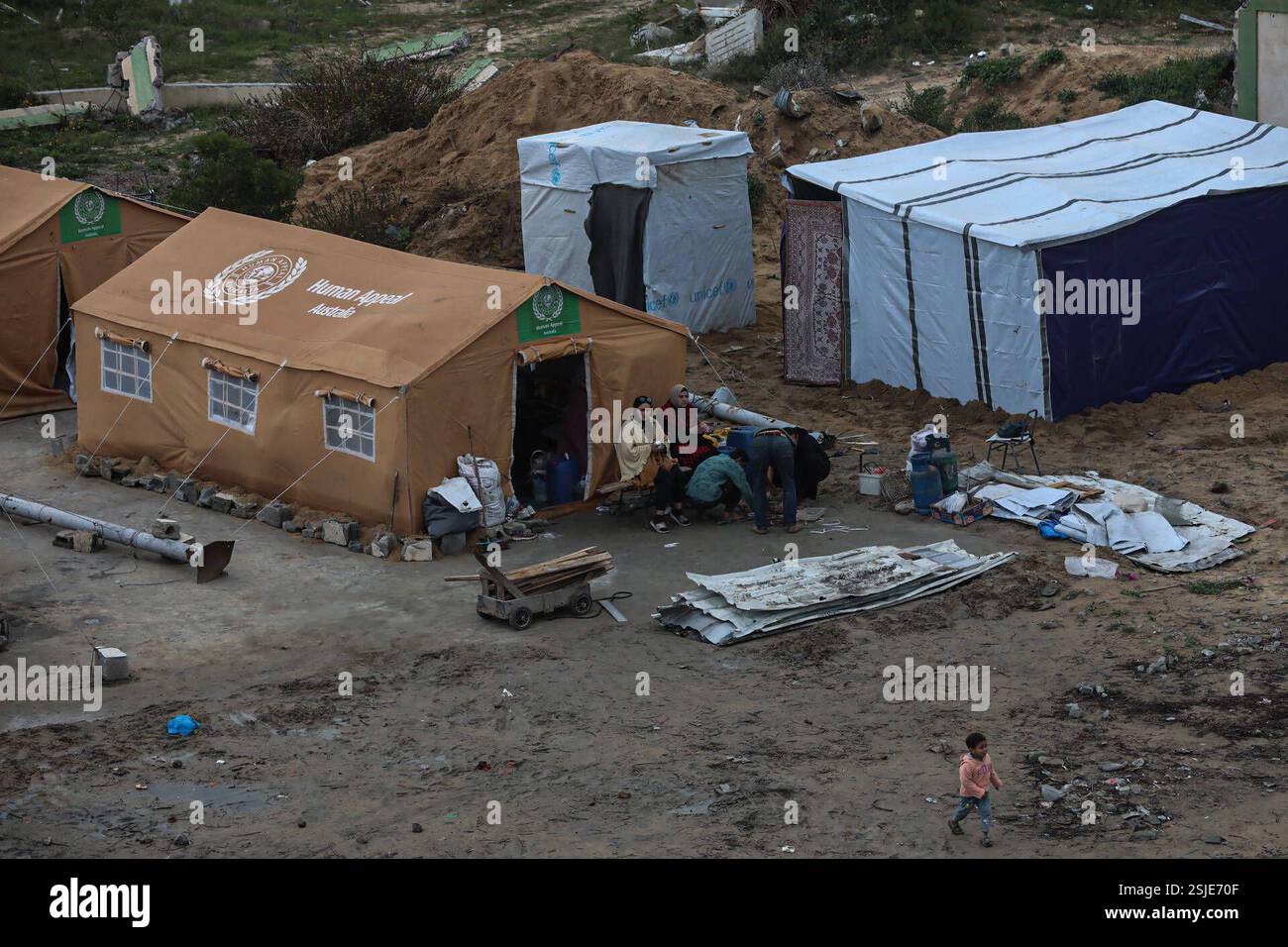 Tents sheltering displaced Palestinians are erected in the yards of ...