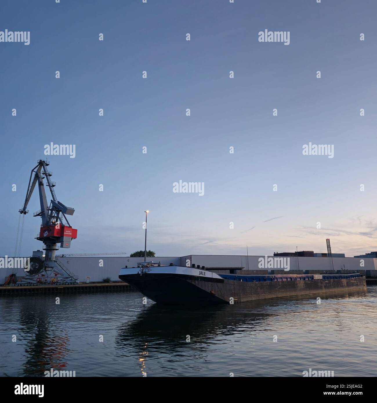 A beautiful and serene view of a large cargo ship securely docked at a ...
