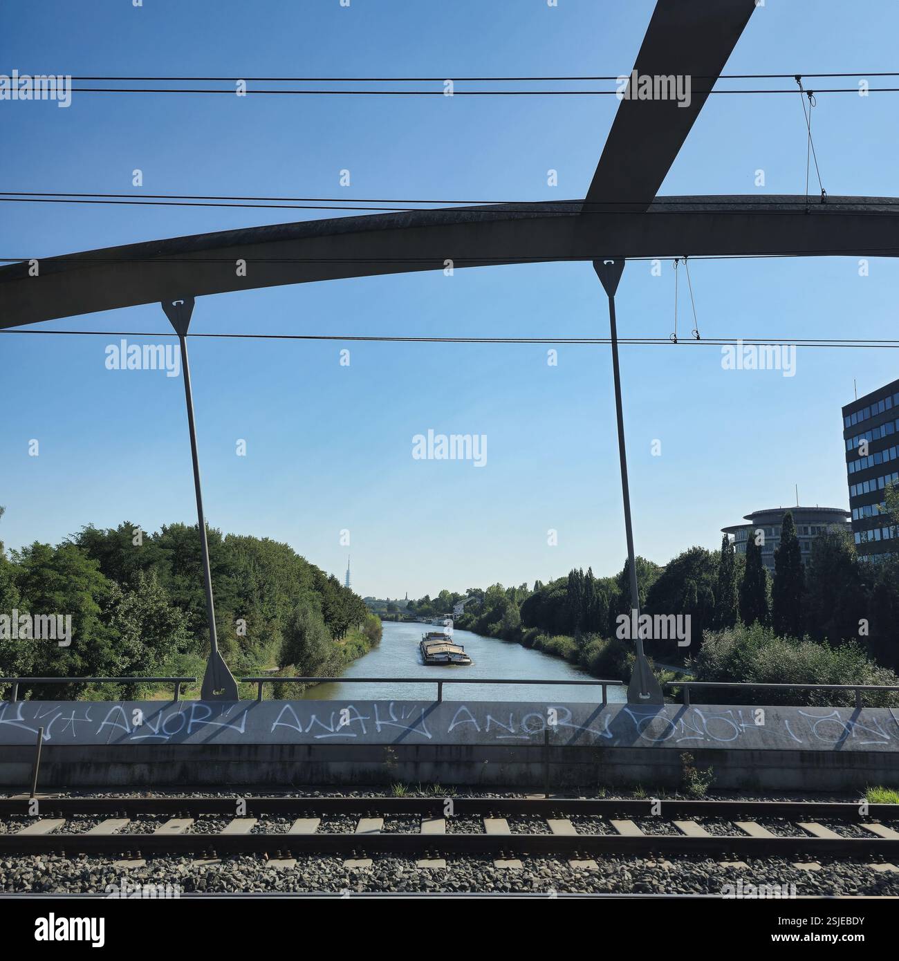 A stunning view of a modern bridge over a tranquil waterway, framed by ...