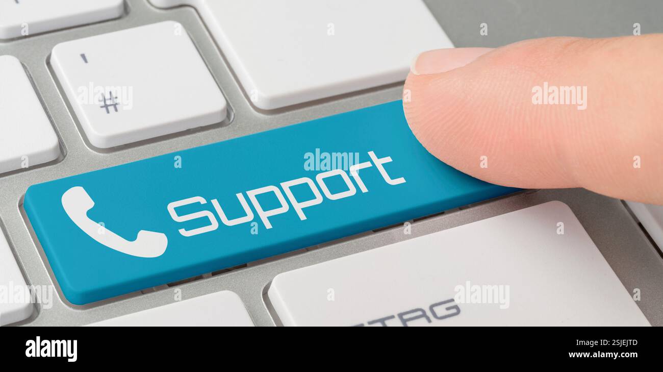 Keyboard with blue key - Support Stock Photo - Alamy