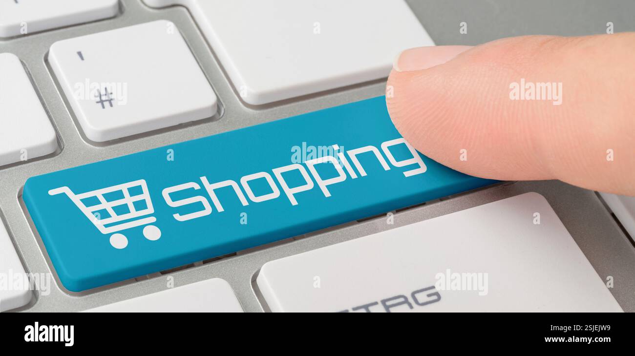 Keyboard with blue key - Shopping Stock Photo - Alamy
