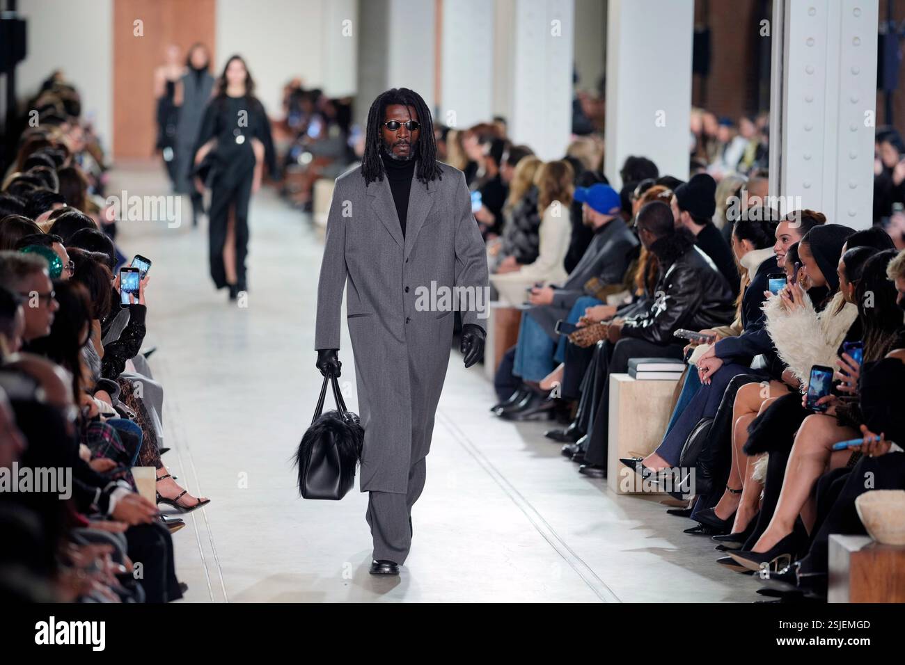 Models walk the runway during the Michael Kors Fall/Winter 2025 fashion ...