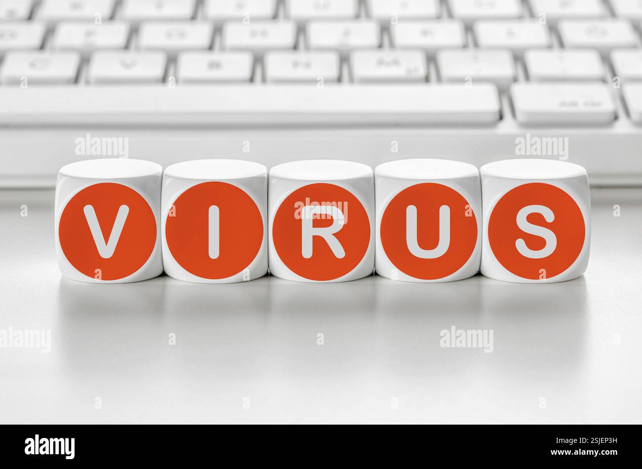 Letter cubes in front of a keyboard virus hi-res stock photography and ...