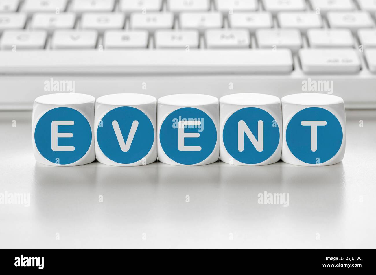 Letter cubes in front of a keyboard - Event Stock Photo - Alamy