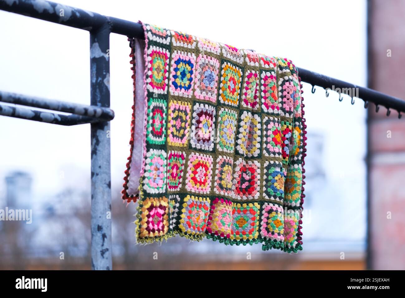 Colorful patchwork quilt hanging outside Stock Photo - Alamy
