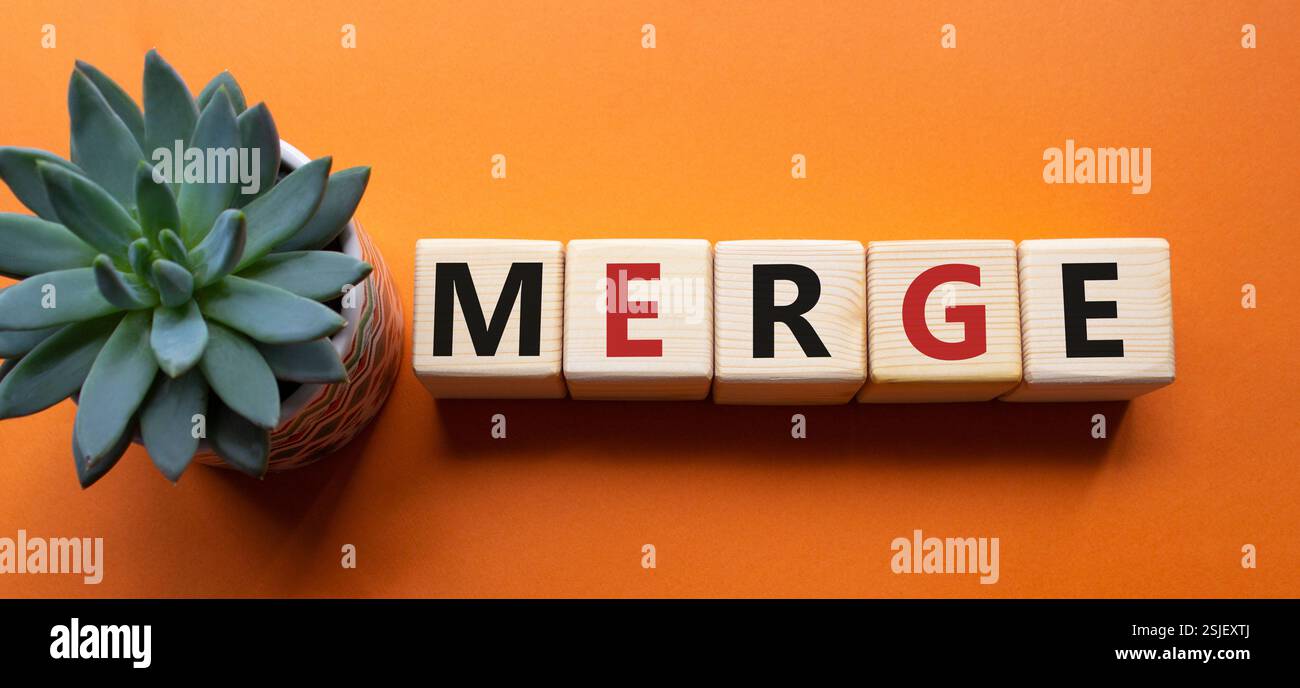 Merge symbol. Wooden cubes with word Merge. Beautiful orange background ...