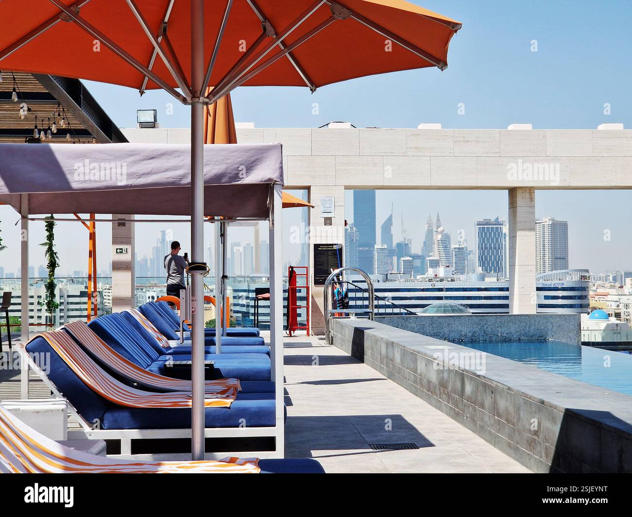 Deira, Dubai, United Arab Emirates - 2024-05-26 : A rooftop pool lounge ...
