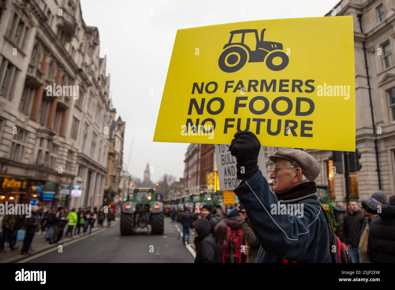 London, Westminster, UK. 10th Feb, 2025. An activist holds up a protest ...