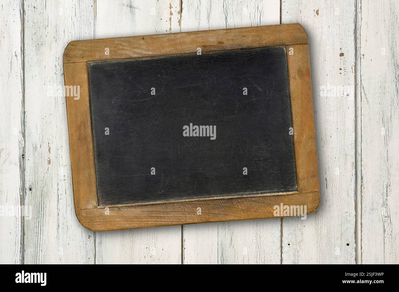 Chalkboard in front of white wooden boards Stock Photo - Alamy