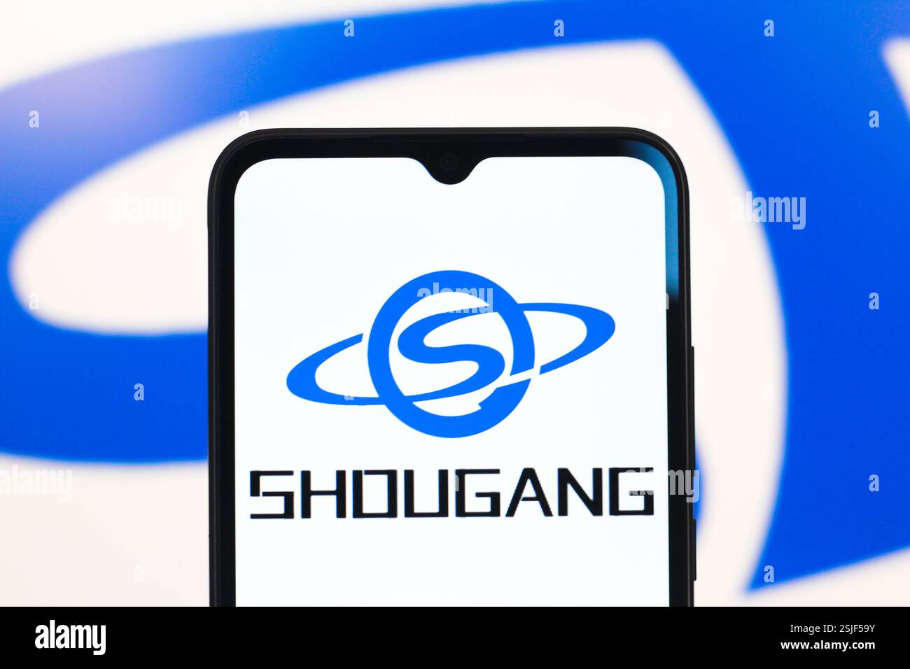 In this photo illustration, the Shougang Group logo is seen displayed ...
