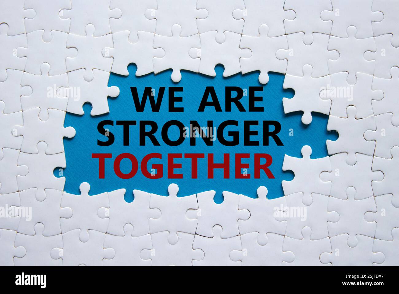 We are stronger together symbol. White puzzle with words We are ...