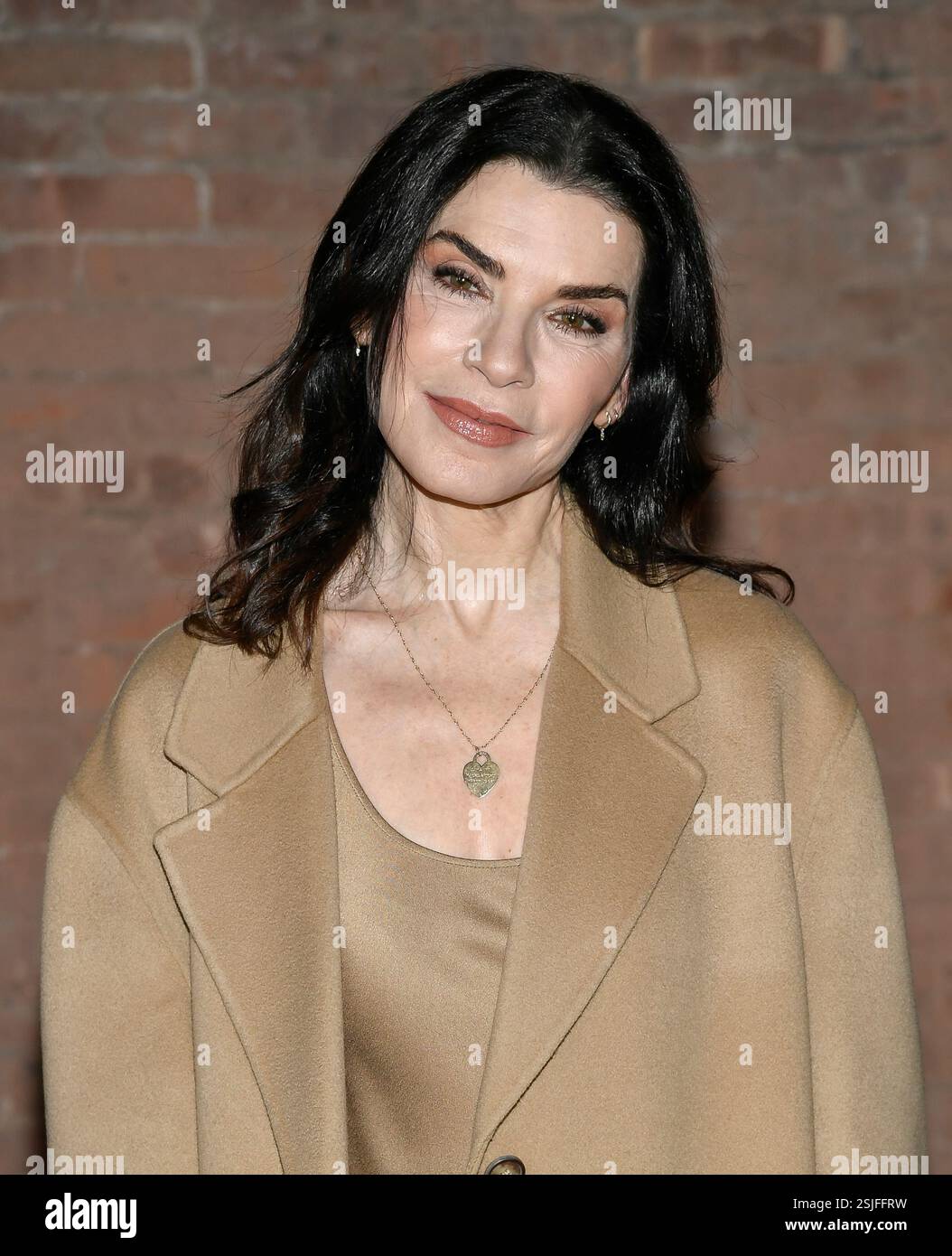 Julianna Margulies arrives at the Michael Kors Fall/Winter 2025 fashion ...