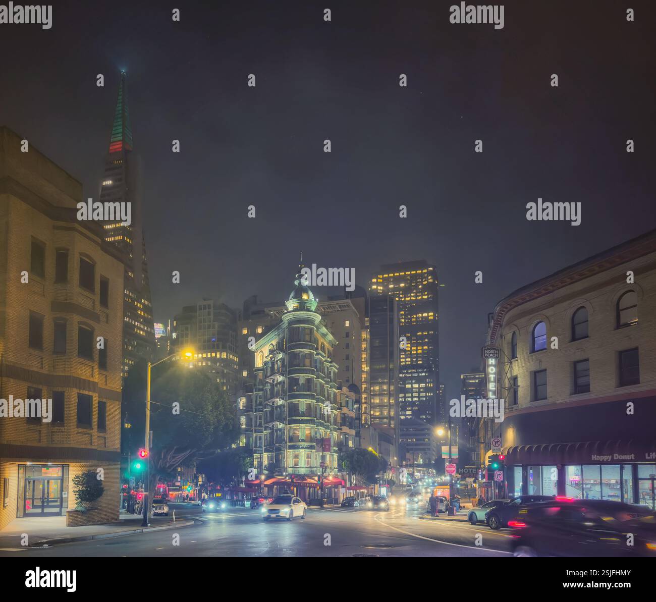 A nighttime cityscape of San Francisco, featuring a bustling street ...