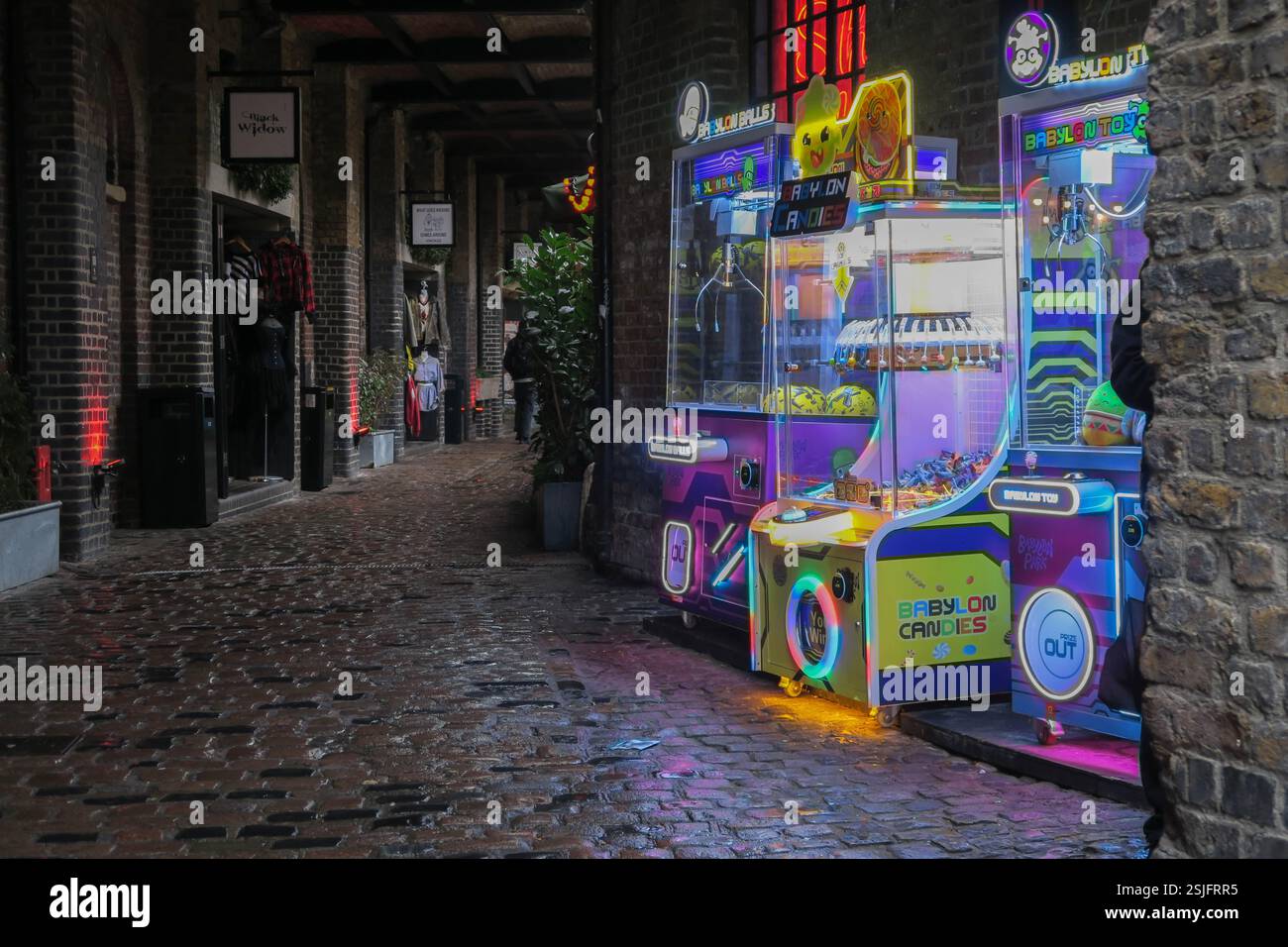 Illuminated claw machines in Camden Market, London Stock Photo - Alamy