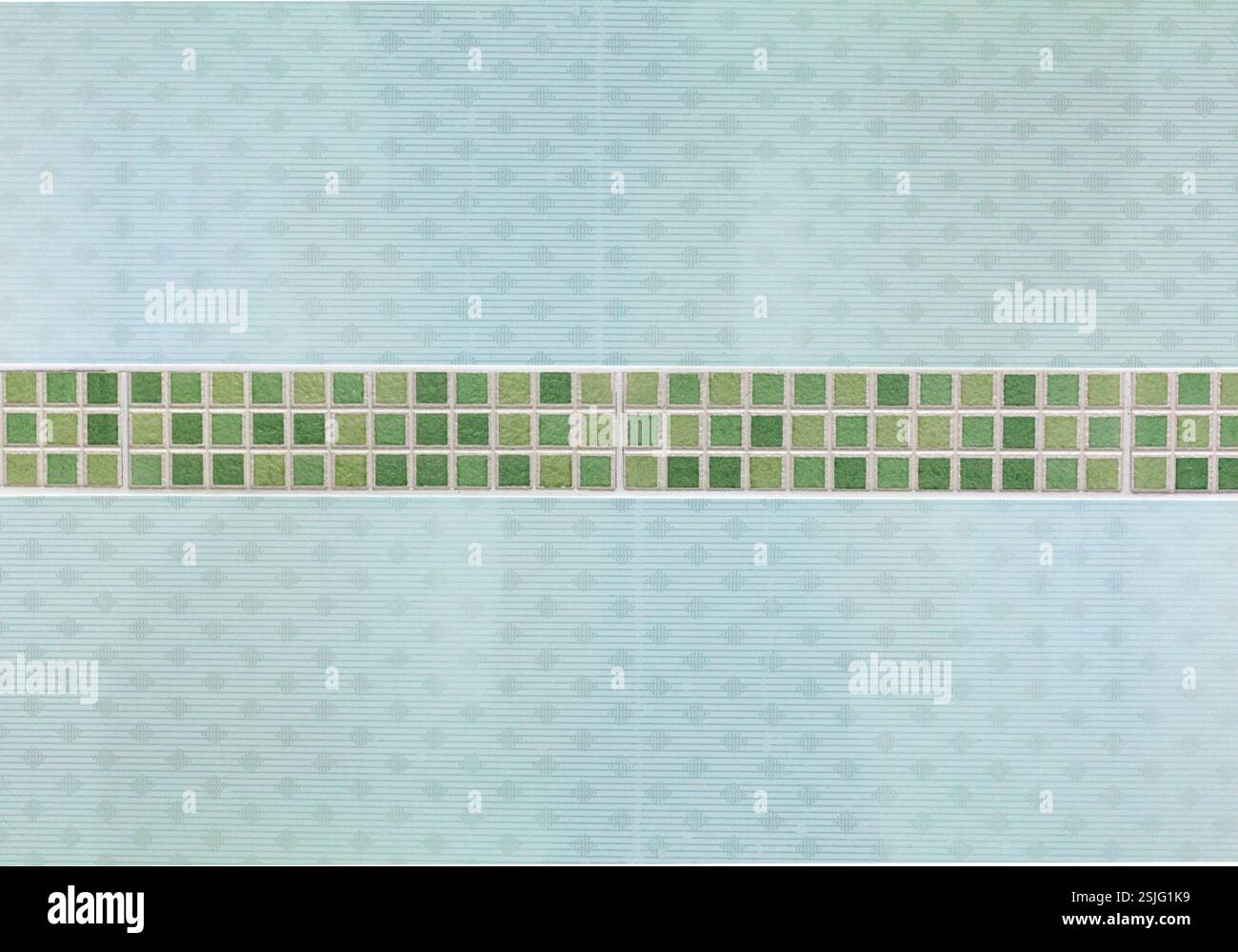 Blue and green tiles with row mosaic assembled on the bathroom wall ...