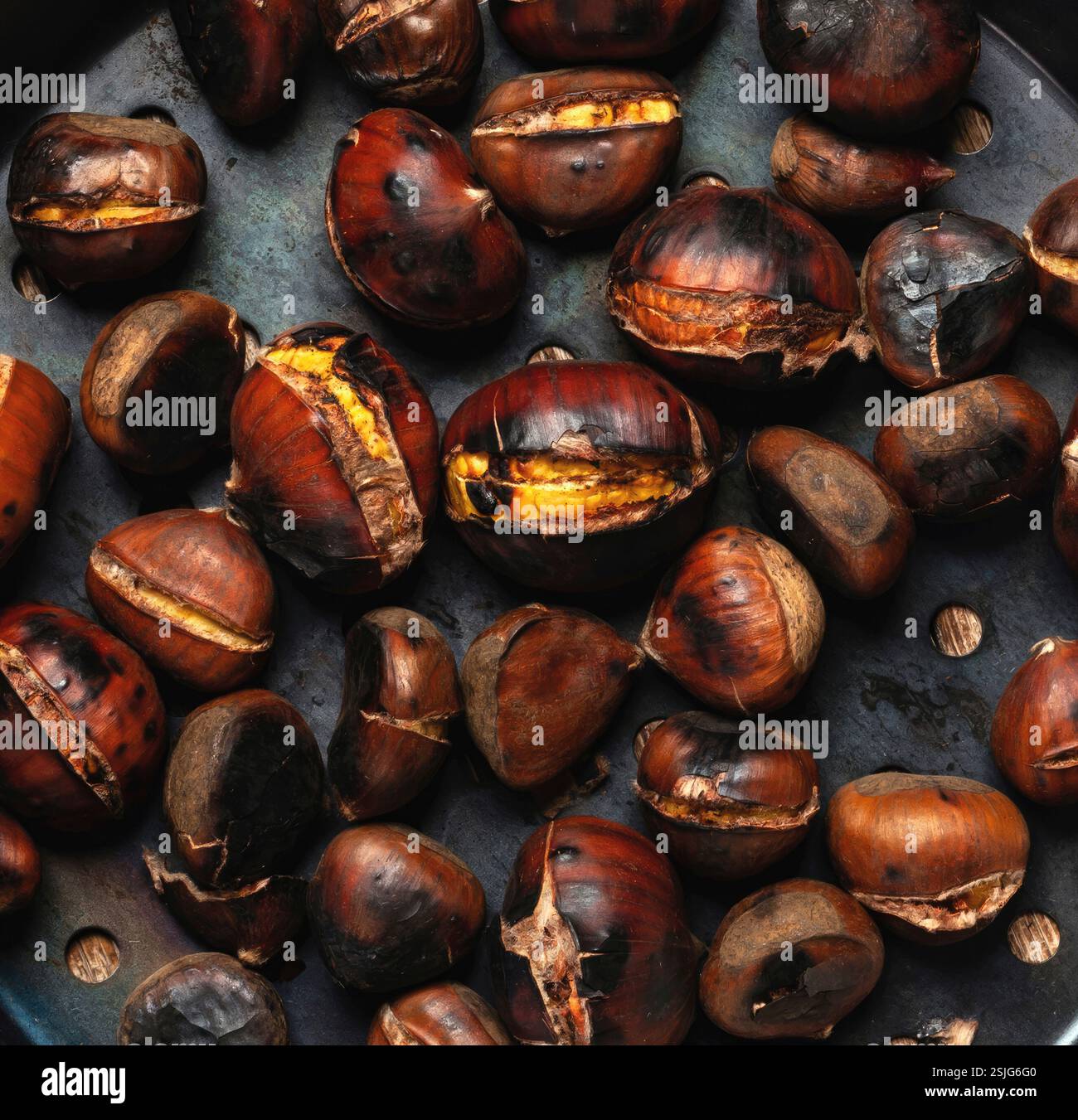 Delicious roasted chestnuts with their shells open, revealing the ...