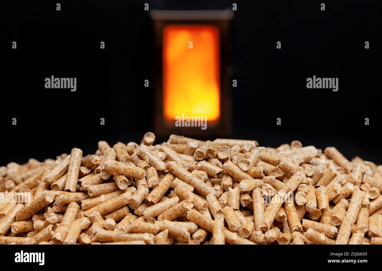 Wood pellets with combustion chamber in the background Stock Photo - Alamy