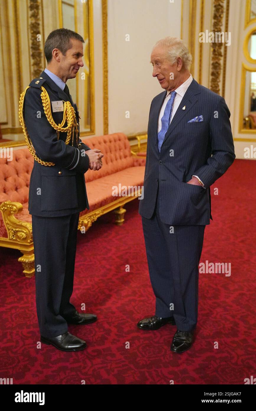 King Charles III speaking to Air Vice-Marshal Adrian Burns, defence ...