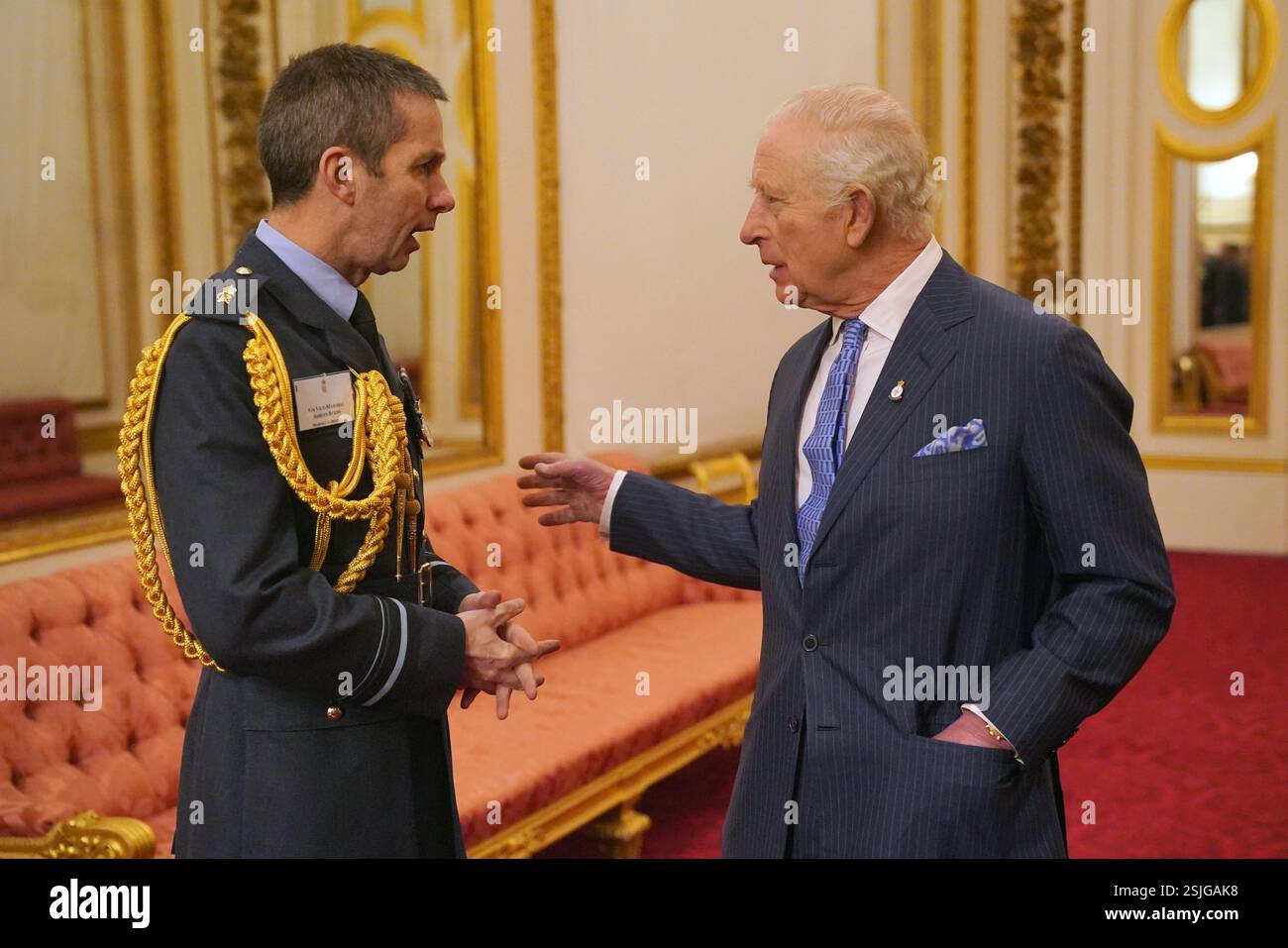 King Charles III speaking to Air Vice-Marshal Adrian Burns, defence ...