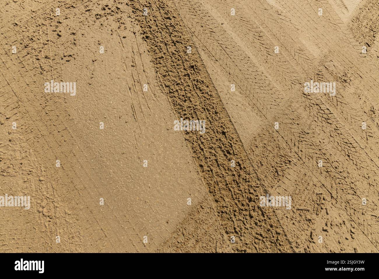 Tire tracks on the navigable sandy beach of Lakolk at low tide on the ...