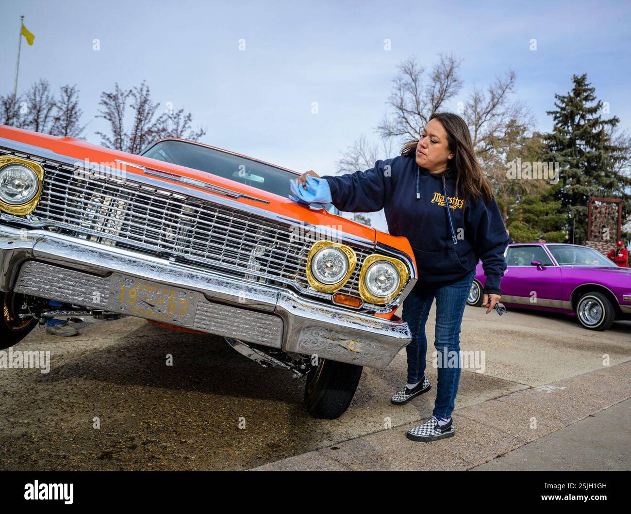 Vicki Garcia cleans her 1963 lowrider Chevy Impala outside of the State ...