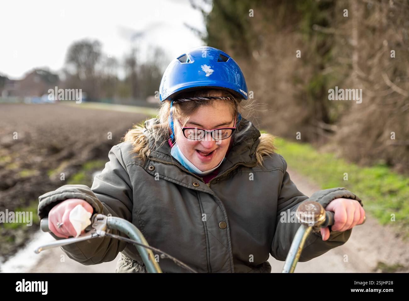 Happy 39 yo woman with the Down Syndrome sitting on her tricycle ...