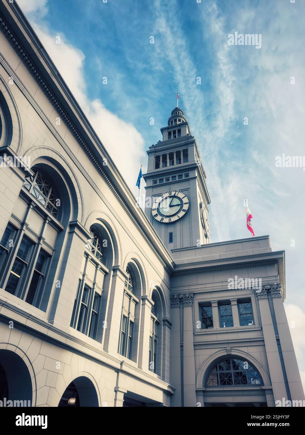 The image showcases a tall, San Francisco Ferry Building clock tower ...