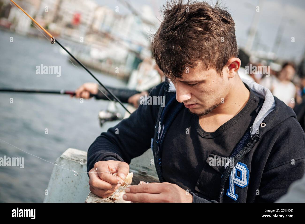 Fisherman setting hooks on the Galata Bridge in Istanbul, Turkey Stock ...