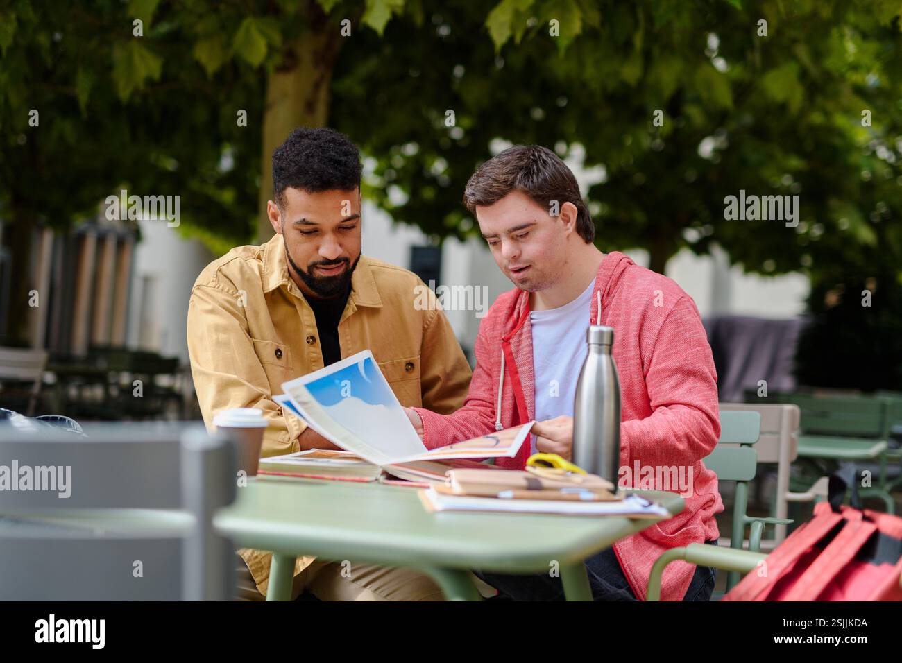 Special educator using multi sensory teaching methods with young man ...