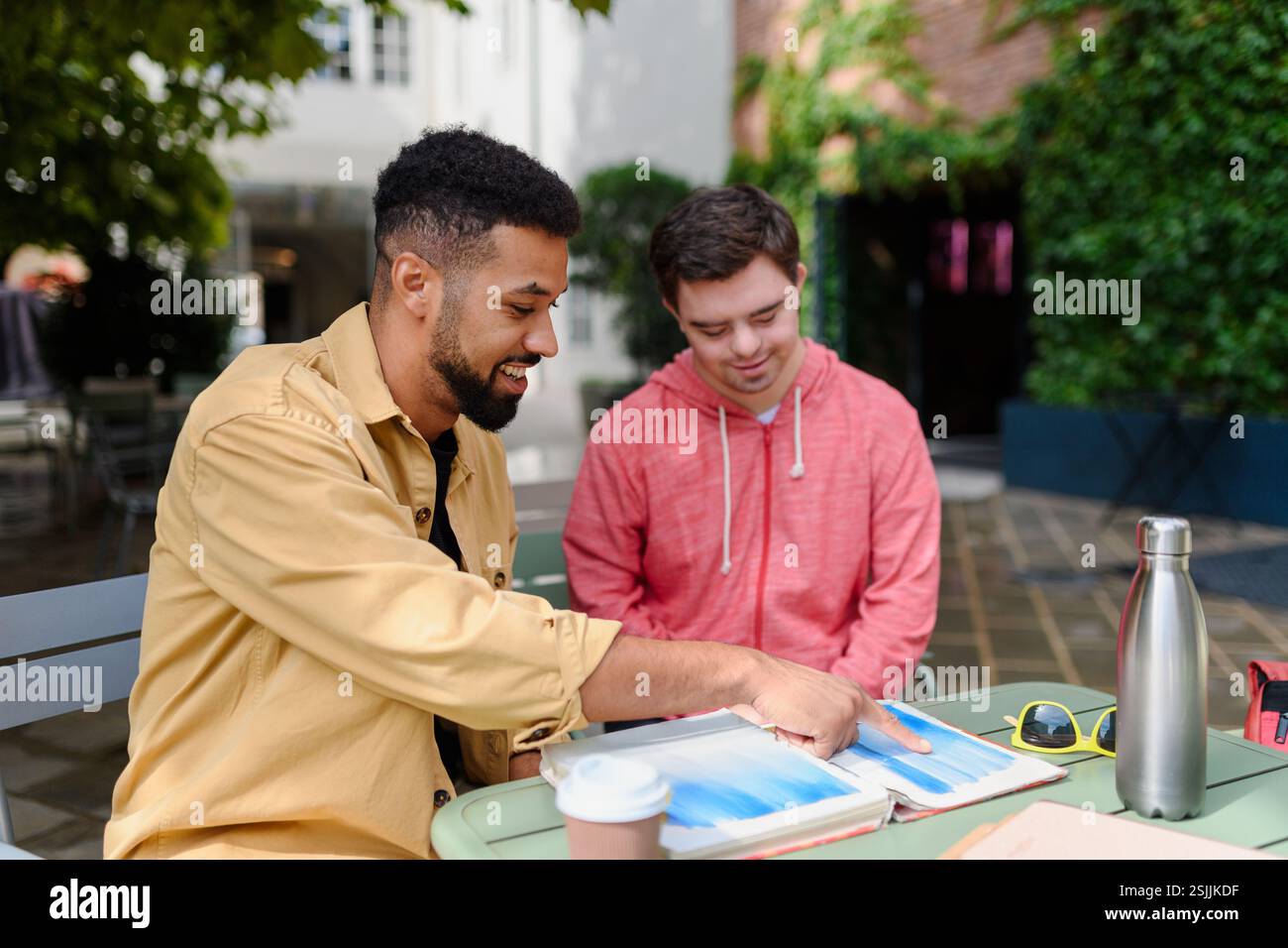 Special educator using multi sensory teaching methods with young man ...