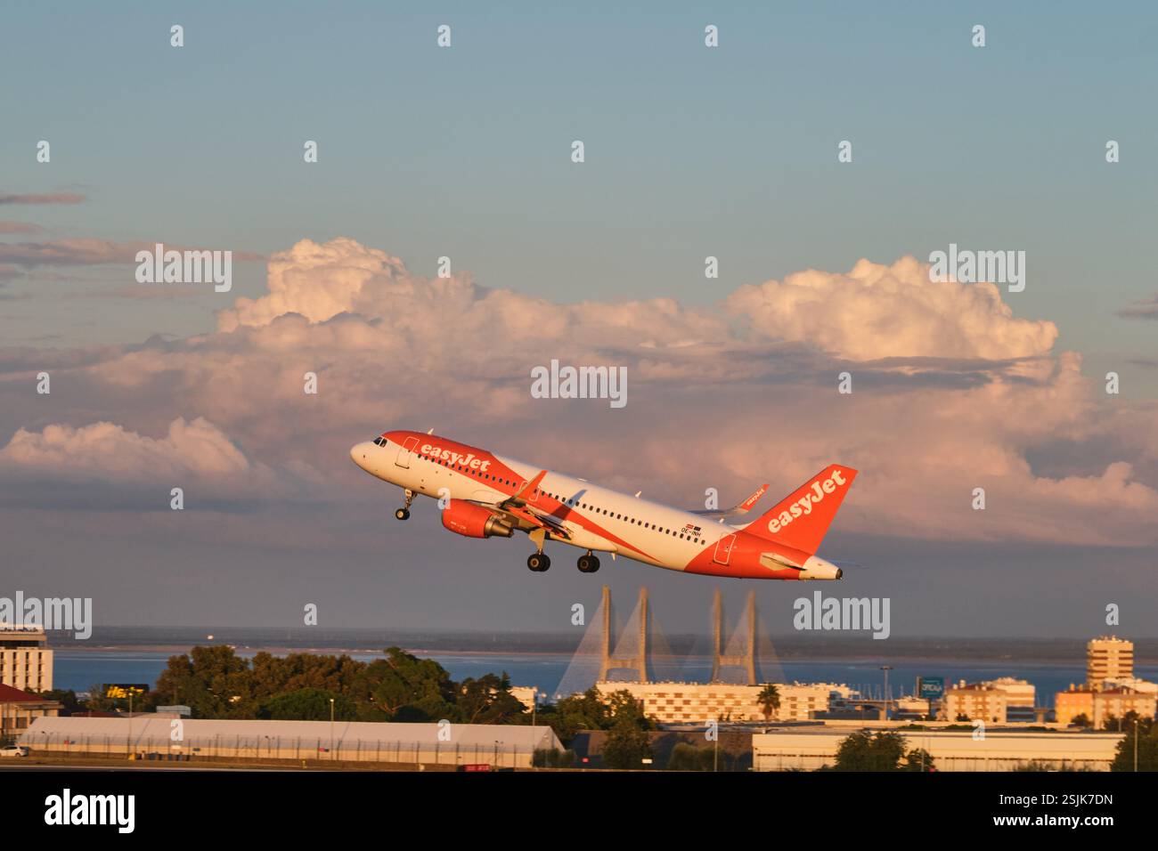 easyJet Airbus A320-214 passenger plane takes off on runway in Humberto ...