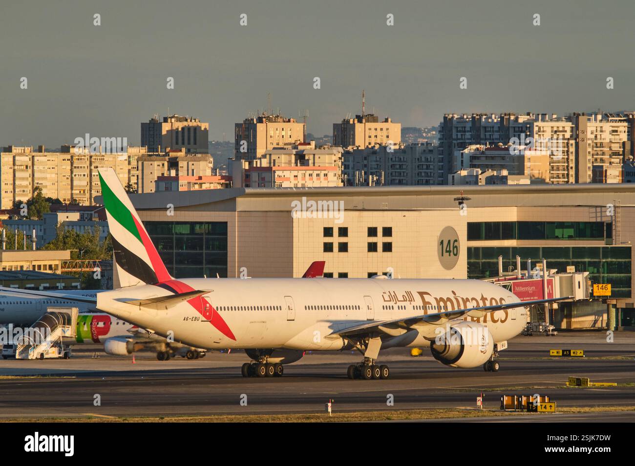 Emirates Boeing 777-31H passenger plane taxi on runway in Humberto ...