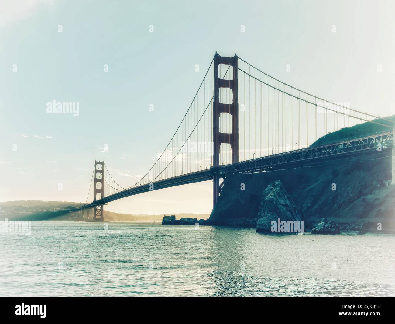 The iconic Golden Gate Bridge stretches across the water, its red ...