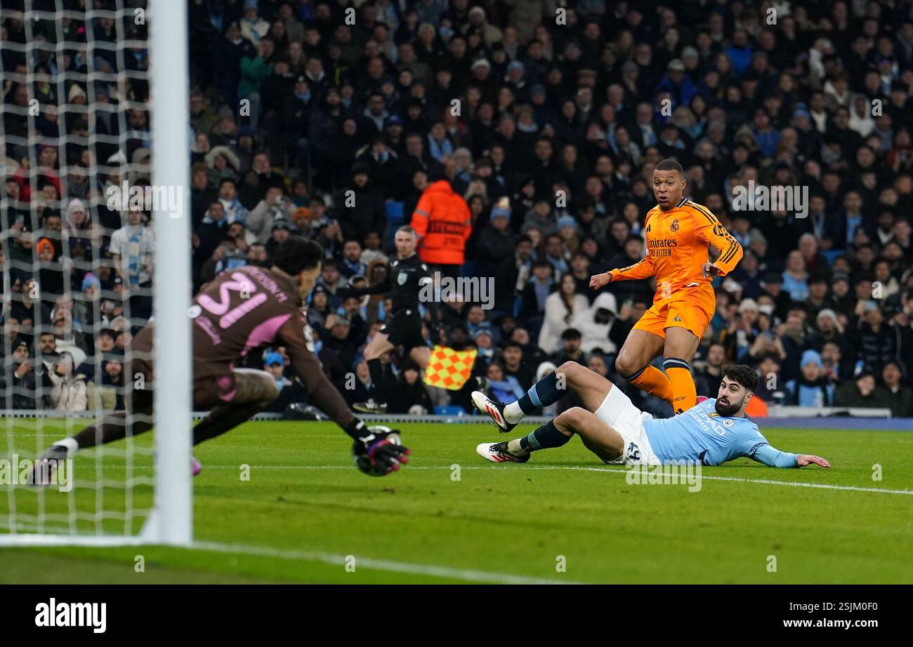 Real Madrid's Kylian Mbappe has a shot saved by Manchester City ...