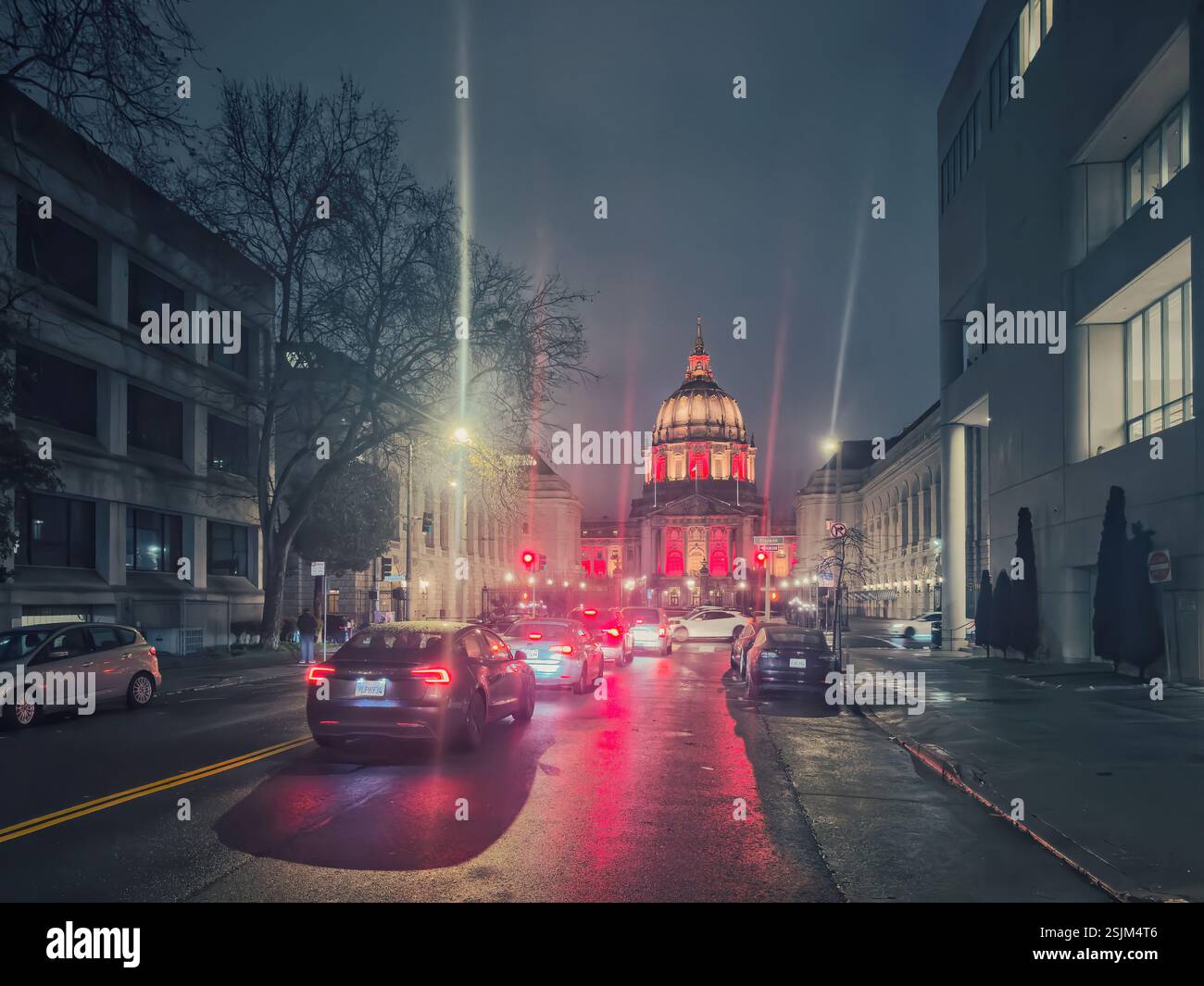 A nighttime photograph captures San Francisco City Hall illuminated in ...