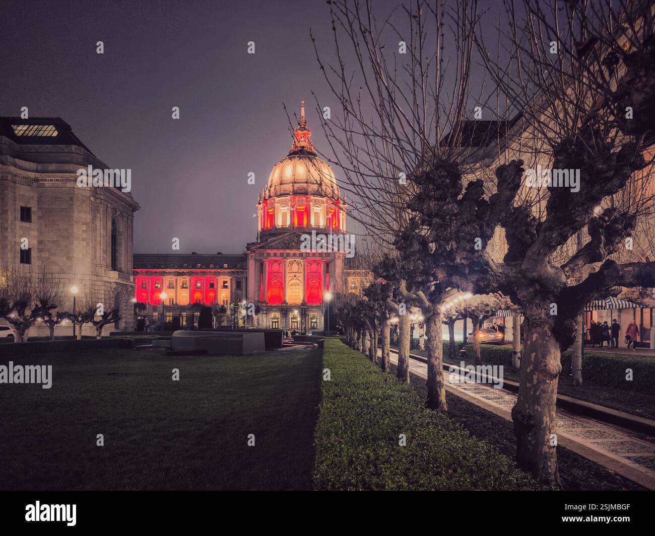 A nighttime photograph captures San Francisco City Hall illuminated in ...