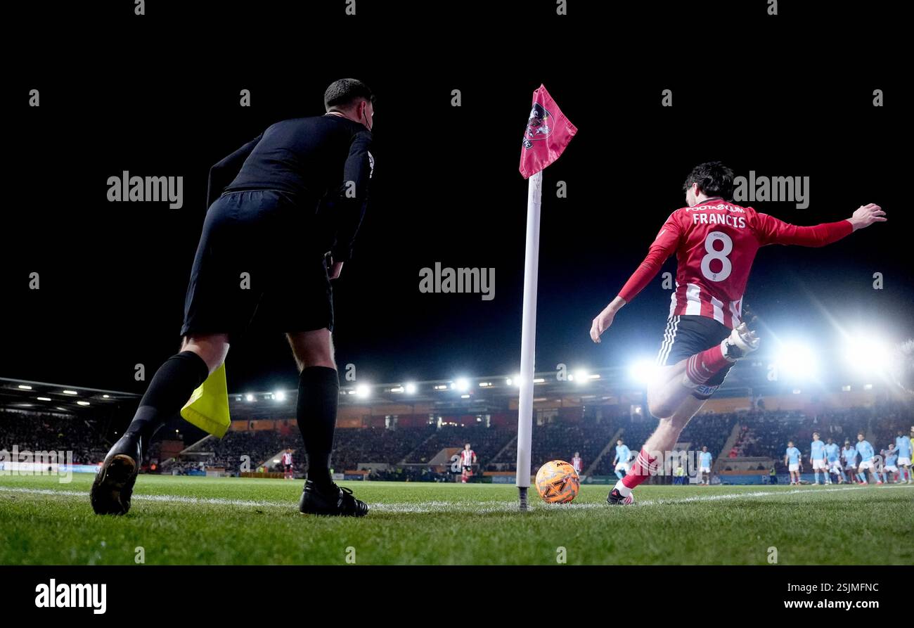 Exeter City's Ed Francis takes a corner during the Emirates FA Cup ...